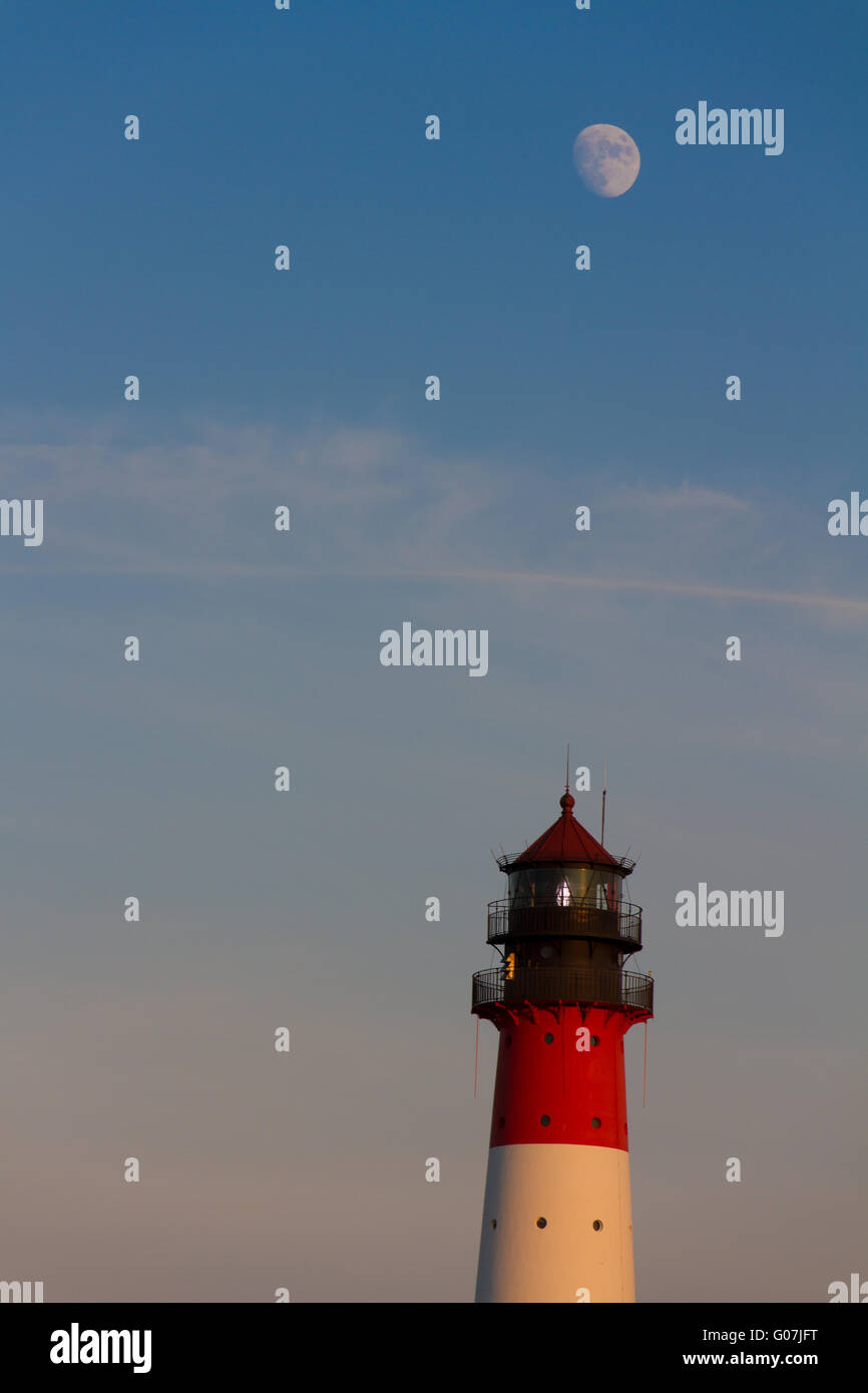 Moon over the Lighthouse Stock Photo - Alamy