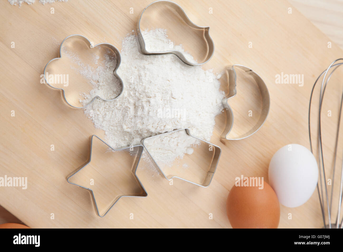 collection of Cookie cutter forms around flour on Stock Photo - Alamy