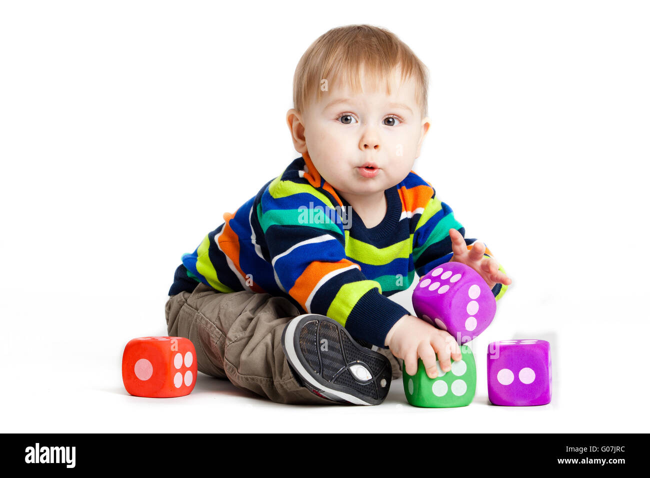 baby is playing with toys over white background Stock Photo - Alamy