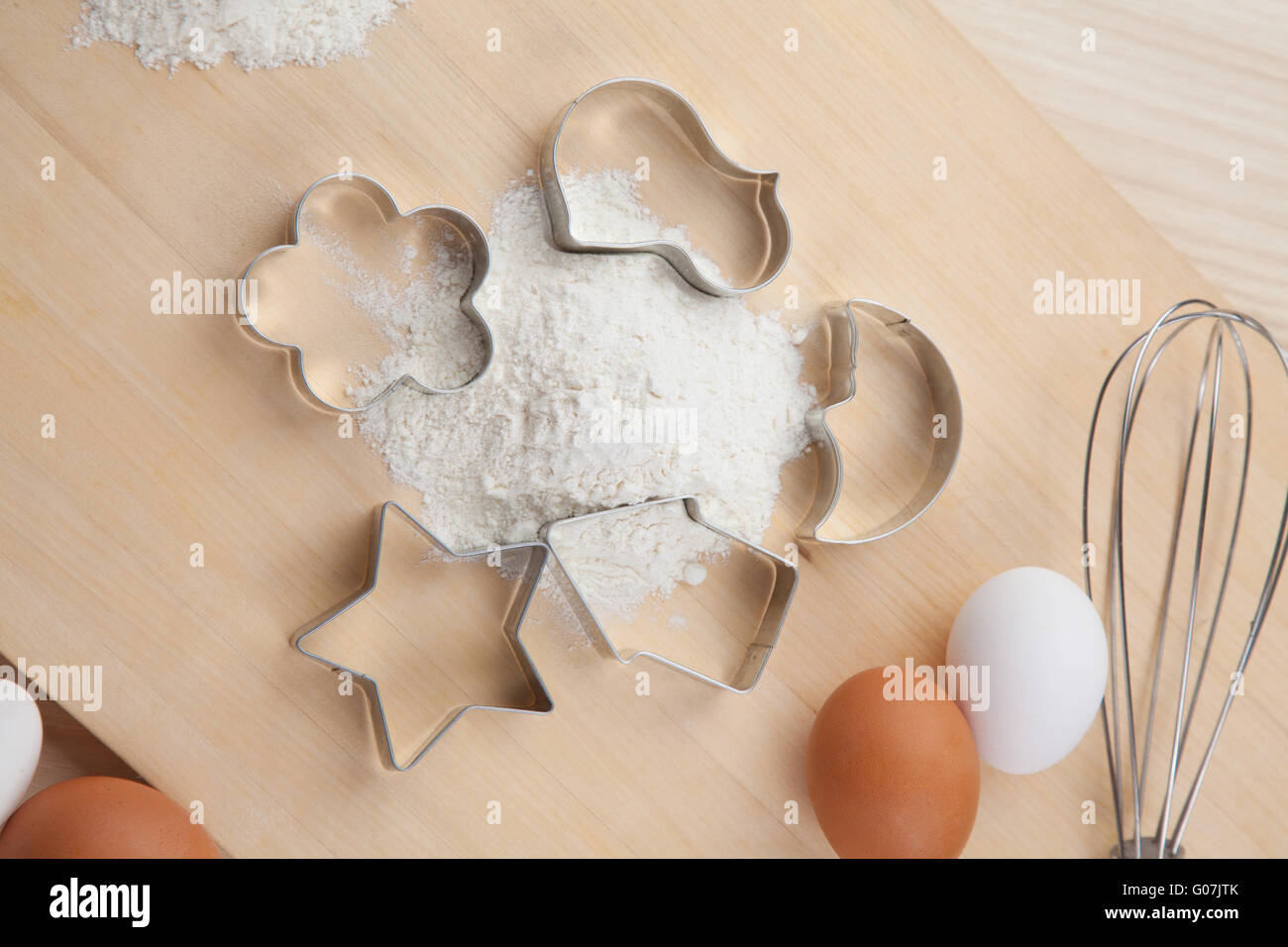 collection of Cookie cutter forms around flour on Stock Photo - Alamy