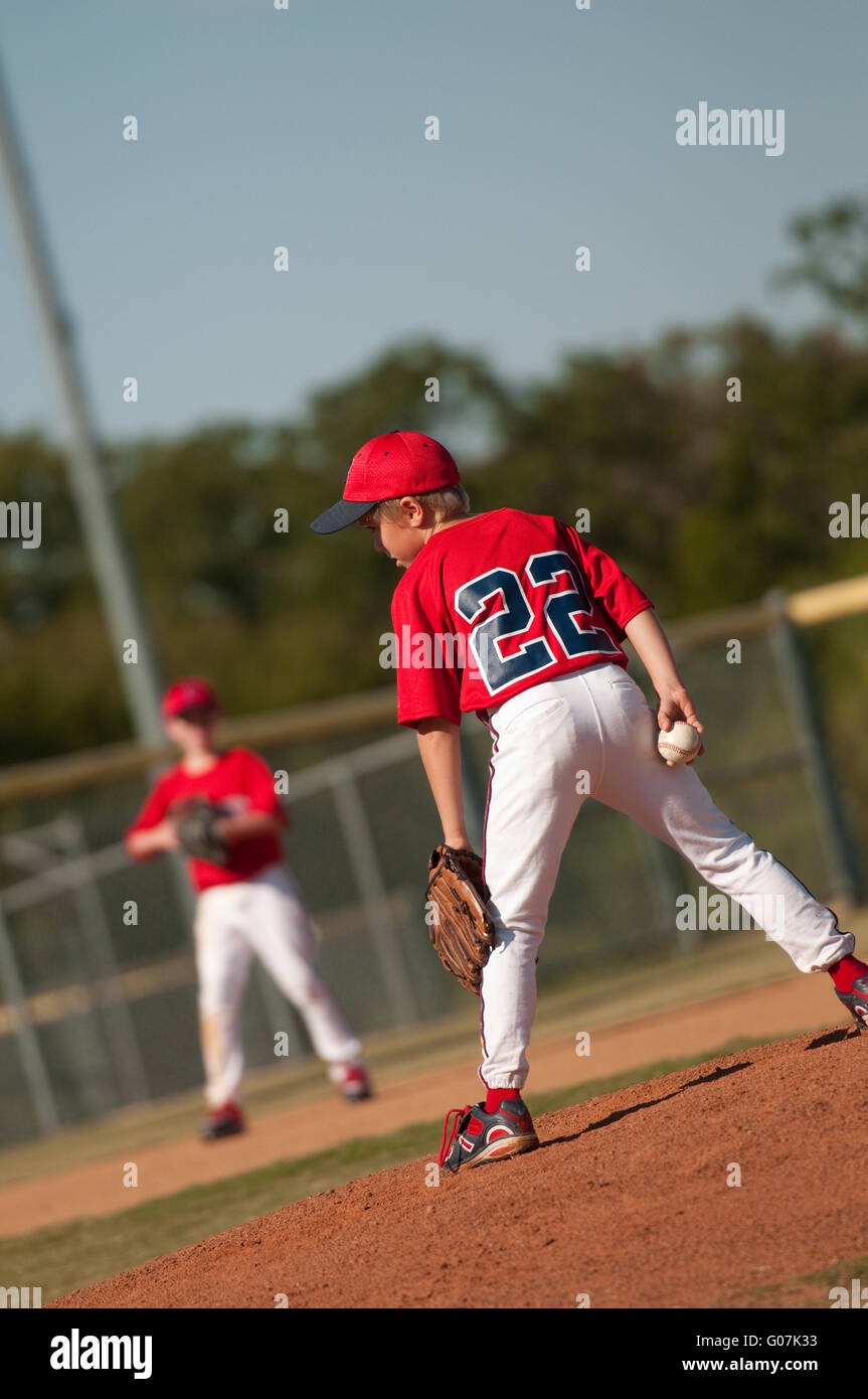 Little league baseball pitcher looking at batter Stock Photo - Alamy