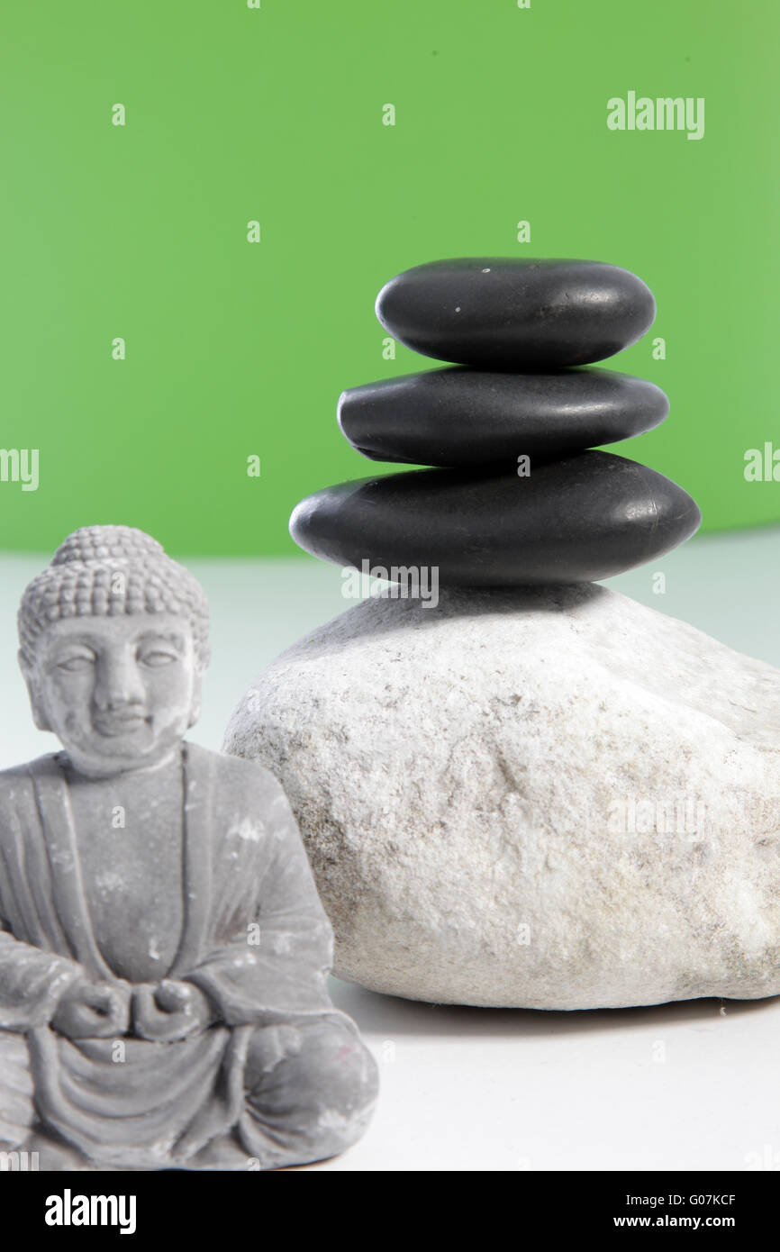 Zen arrangement with spa stones and Buddha statue Stock Photo - Alamy