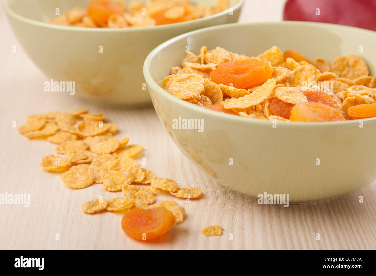 green bowls of crunchy corn flakes for breakfast o Stock Photo - Alamy