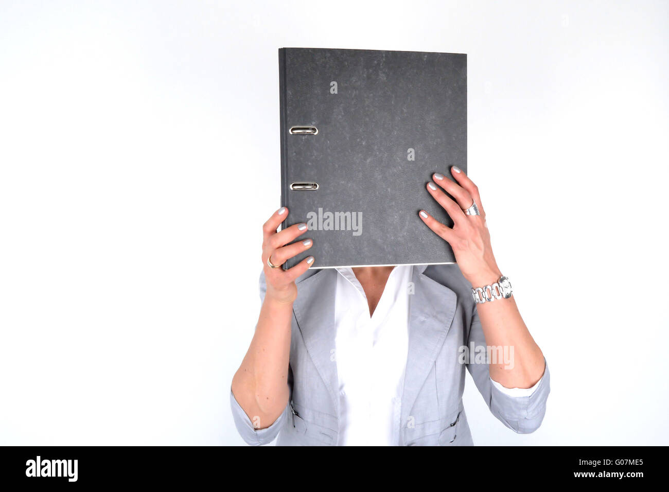 Woman who has a file folder in my face Stock Photo - Alamy