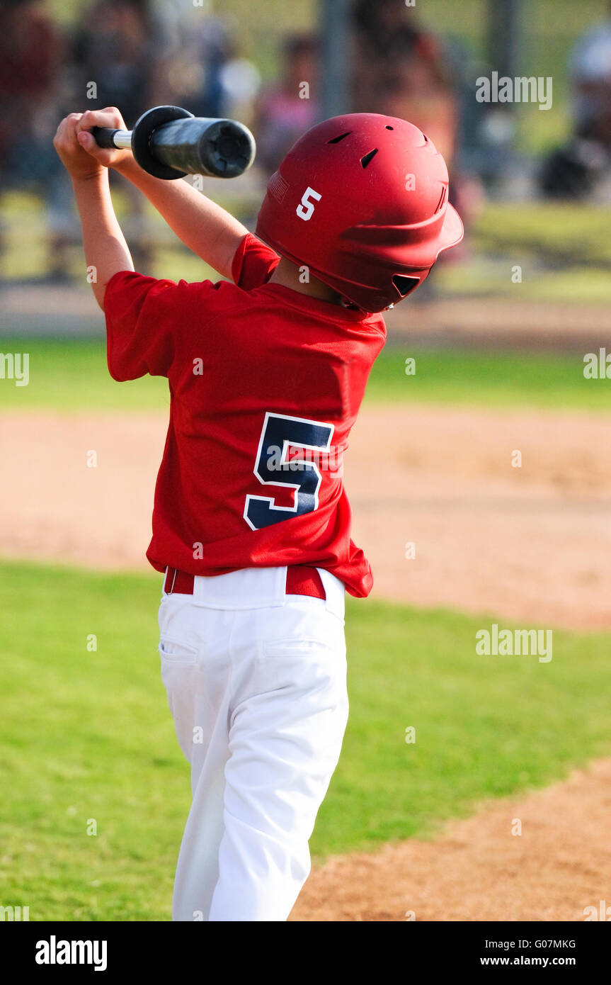 Baseball boy warming up to bat Stock Photo - Alamy