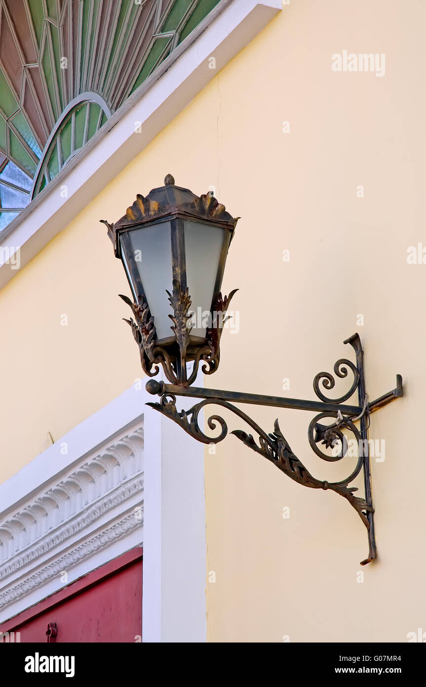 Old lamp with stained glass window on wall Stock Photo - Alamy