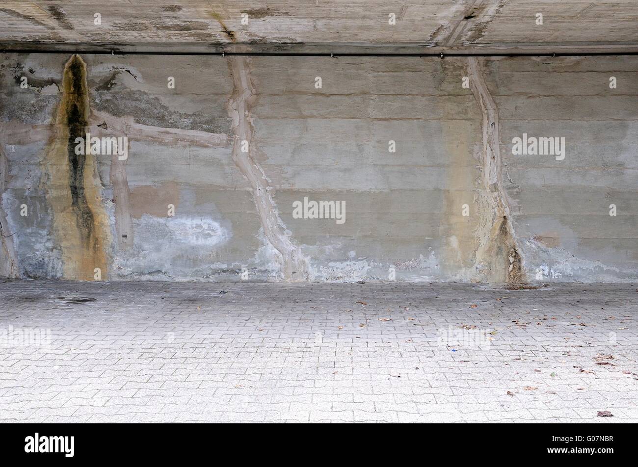 wet and humid - concrete is old and brittle Stock Photo - Alamy