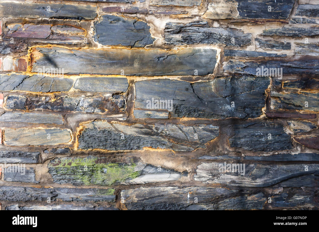 Wall made of natural stone Stock Photo - Alamy