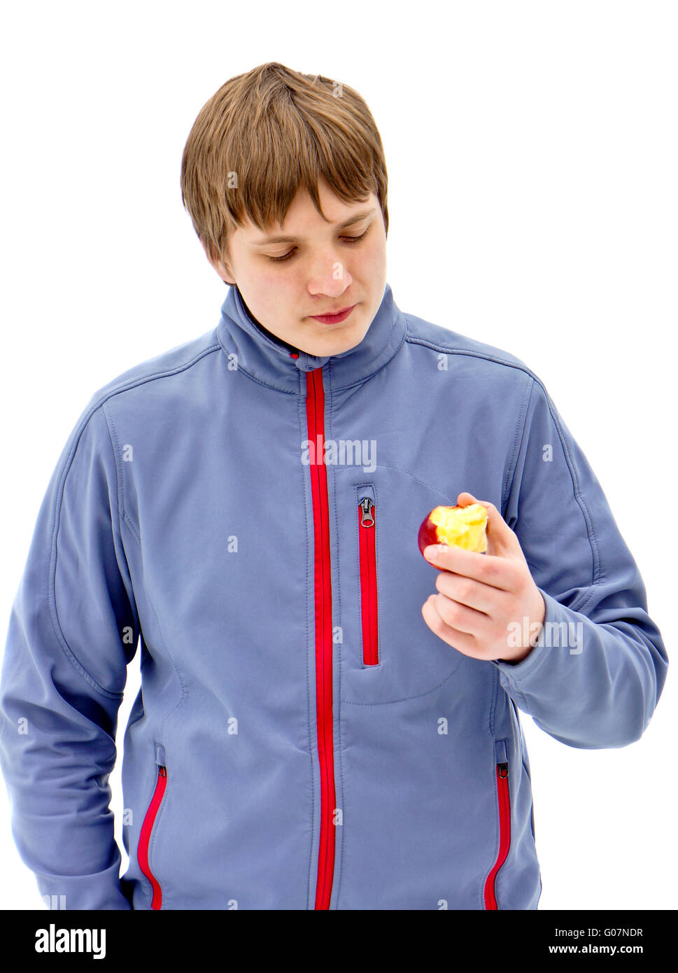 Portrait of a young guy in a jacket, eating apple Stock Photo - Alamy