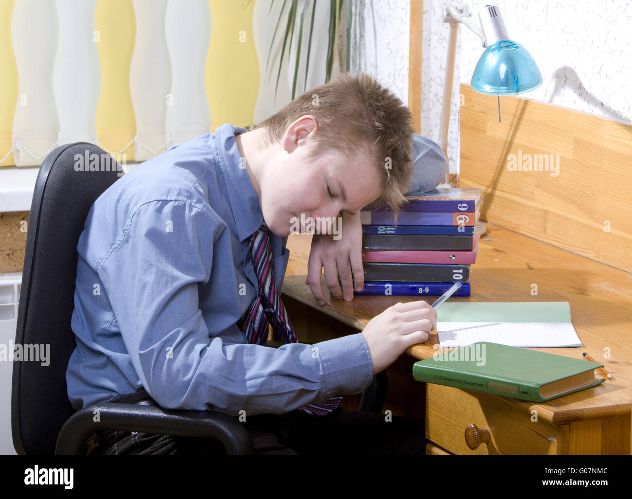 Pupil fell asleep behind performance of homework Stock Photo - Alamy