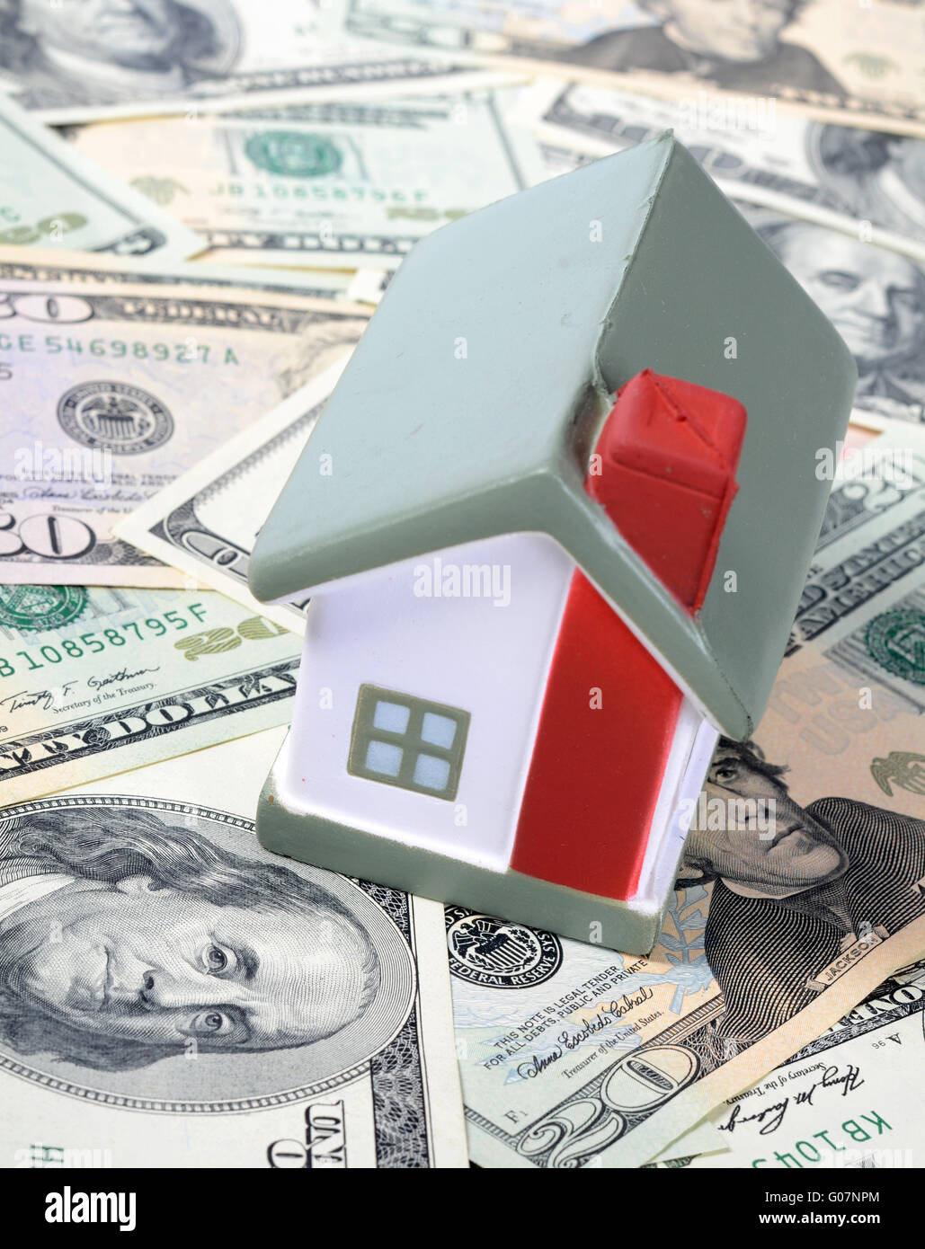 toy house for dollar banknotes as a background Stock Photo - Alamy