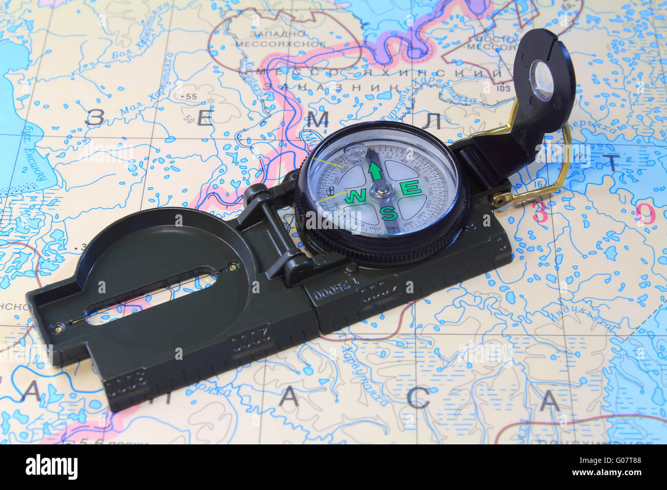 A compass and a map of the North of Russia Stock Photo - Alamy