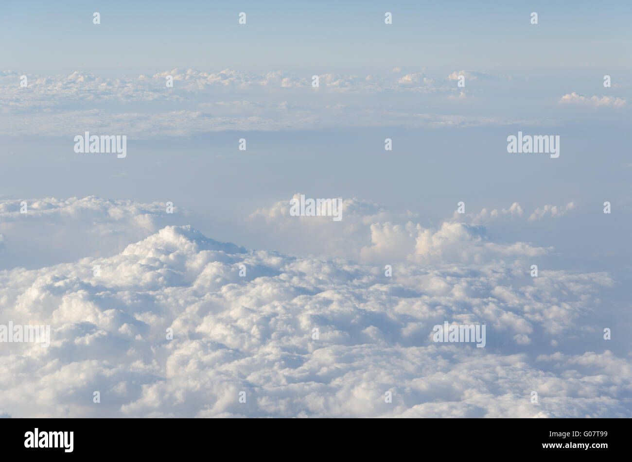 Clouds seen through plane window during flight Stock Photo - Alamy