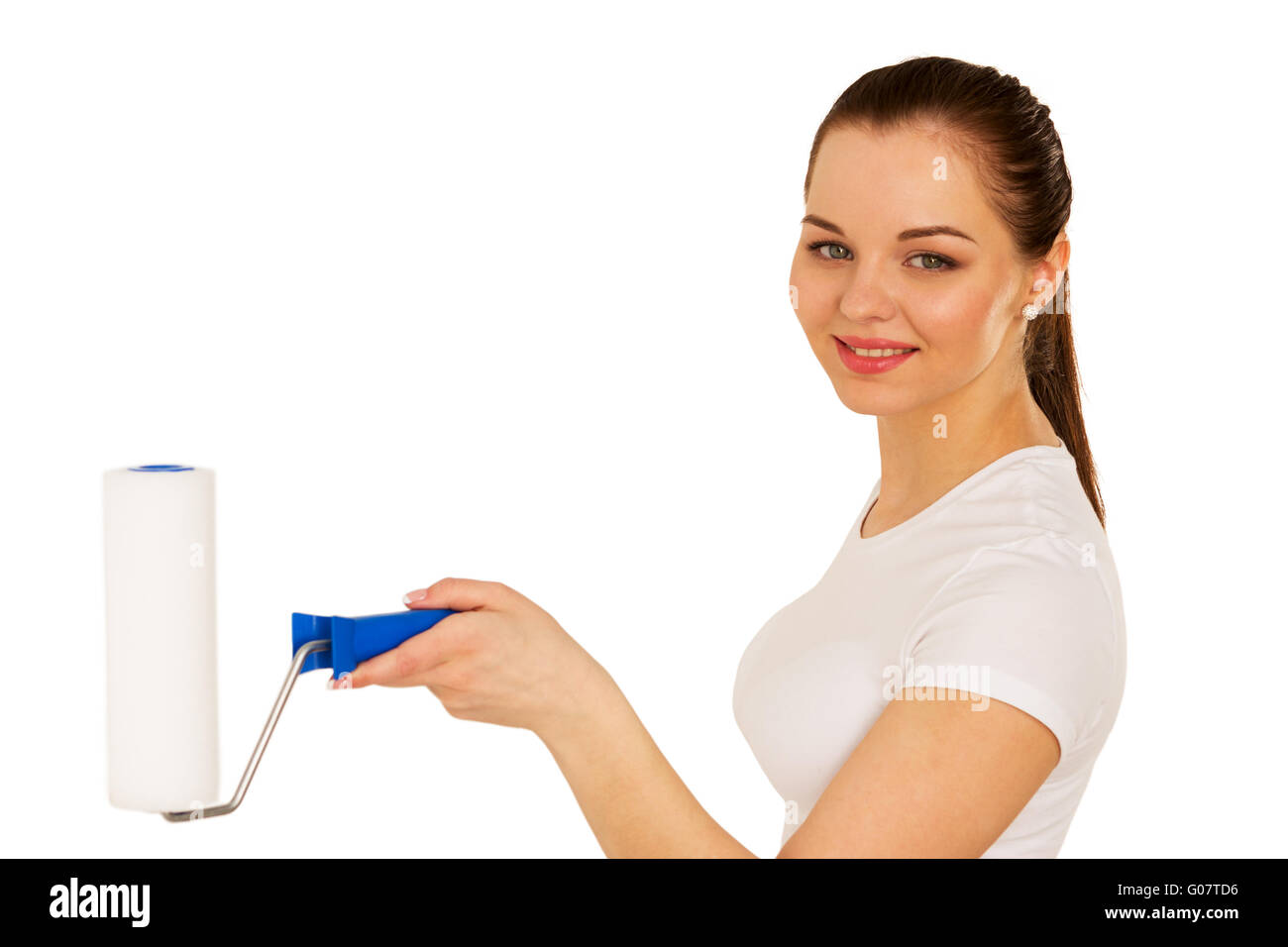 The woman with the roller in hand it is isolated on white background ...