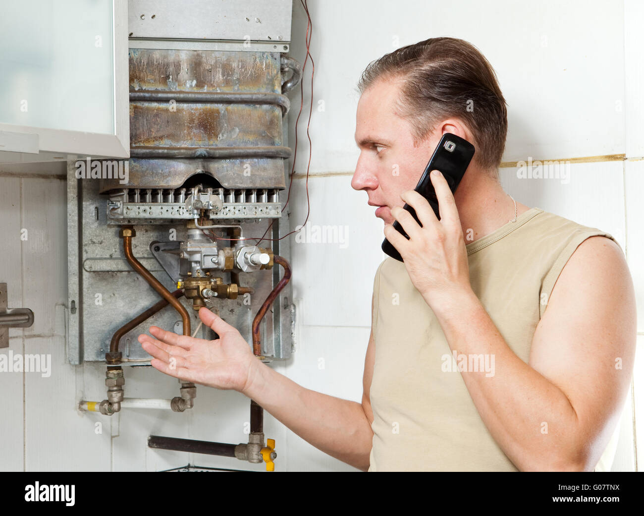 Broken heater repairman hi-res stock photography and images - Alamy
