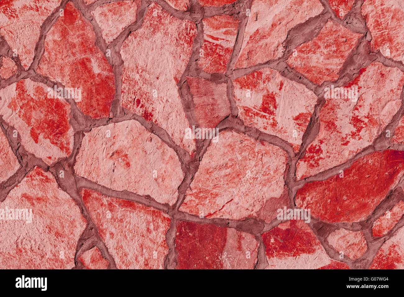 Background of a large stone wall texture (red Stock Photo - Alamy