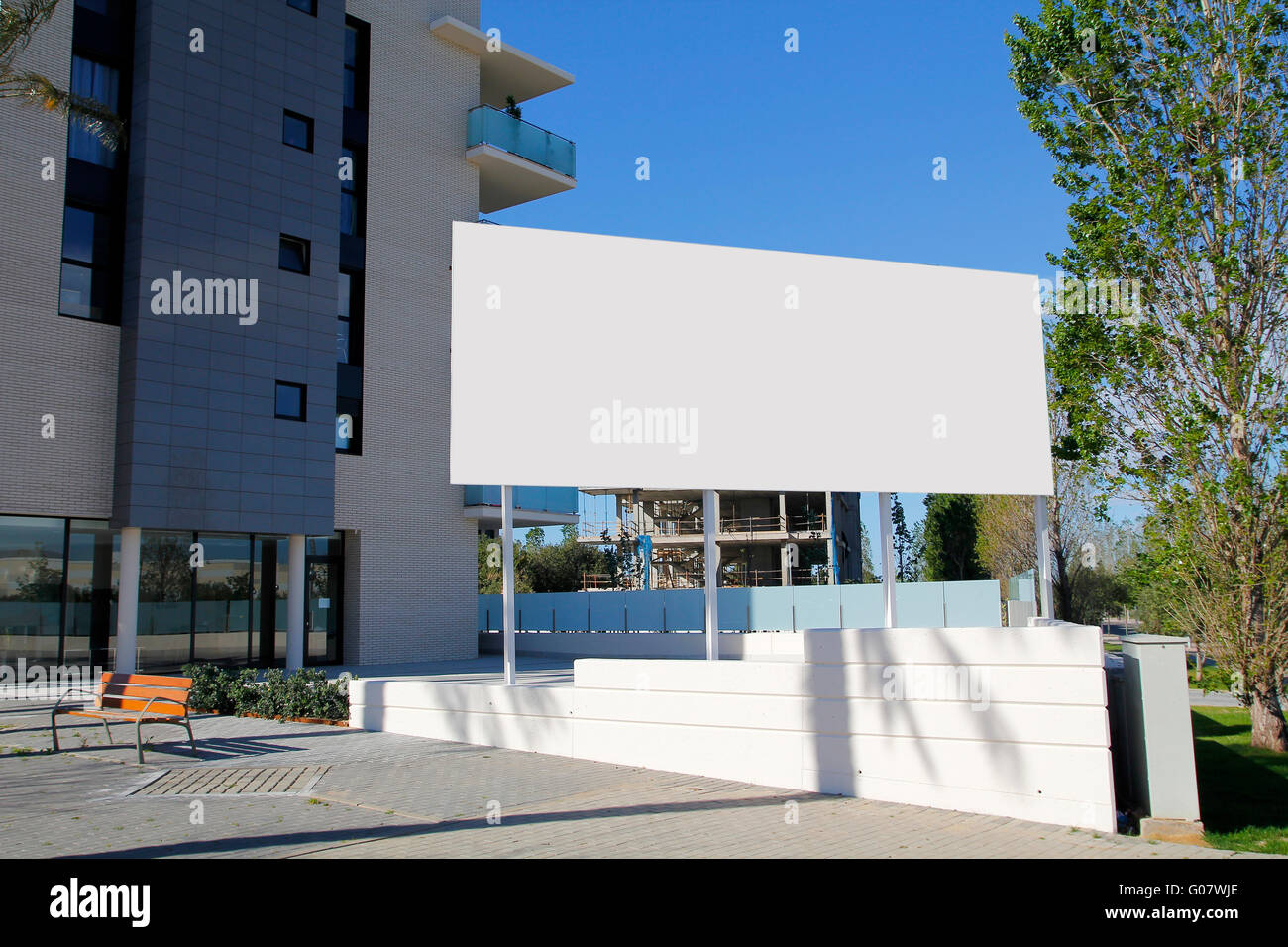Blank billboard in the street, new building promotion Stock Photo - Alamy