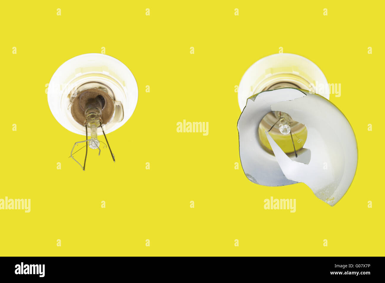 Old,damaged,exploded lamps on a yellow background Stock Photo - Alamy
