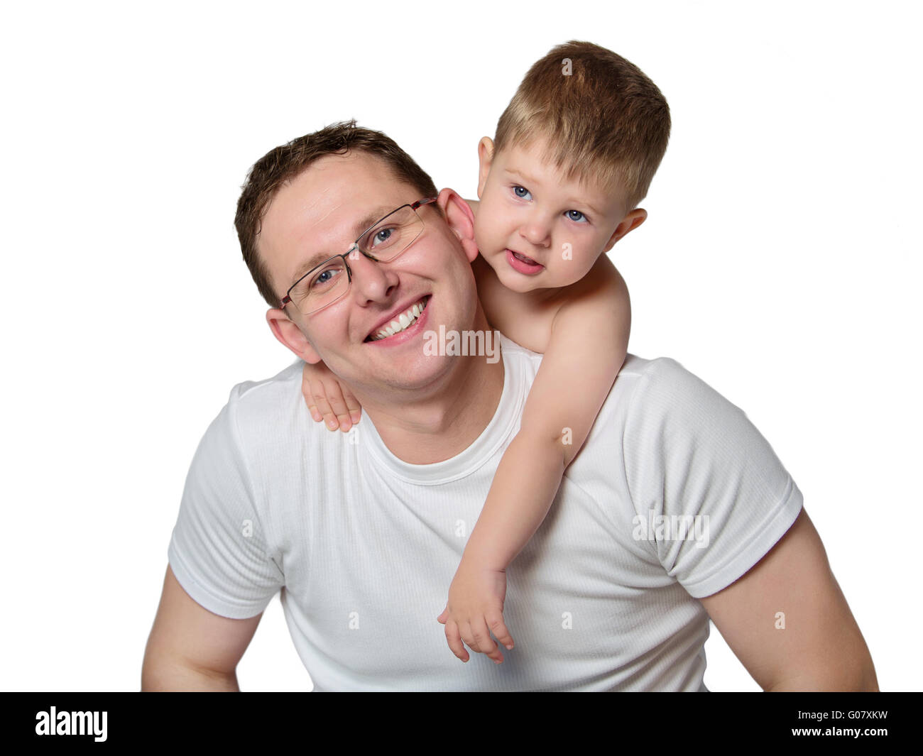 Portrait of a caring young father giving his son piggyback ride against white background Stock ...