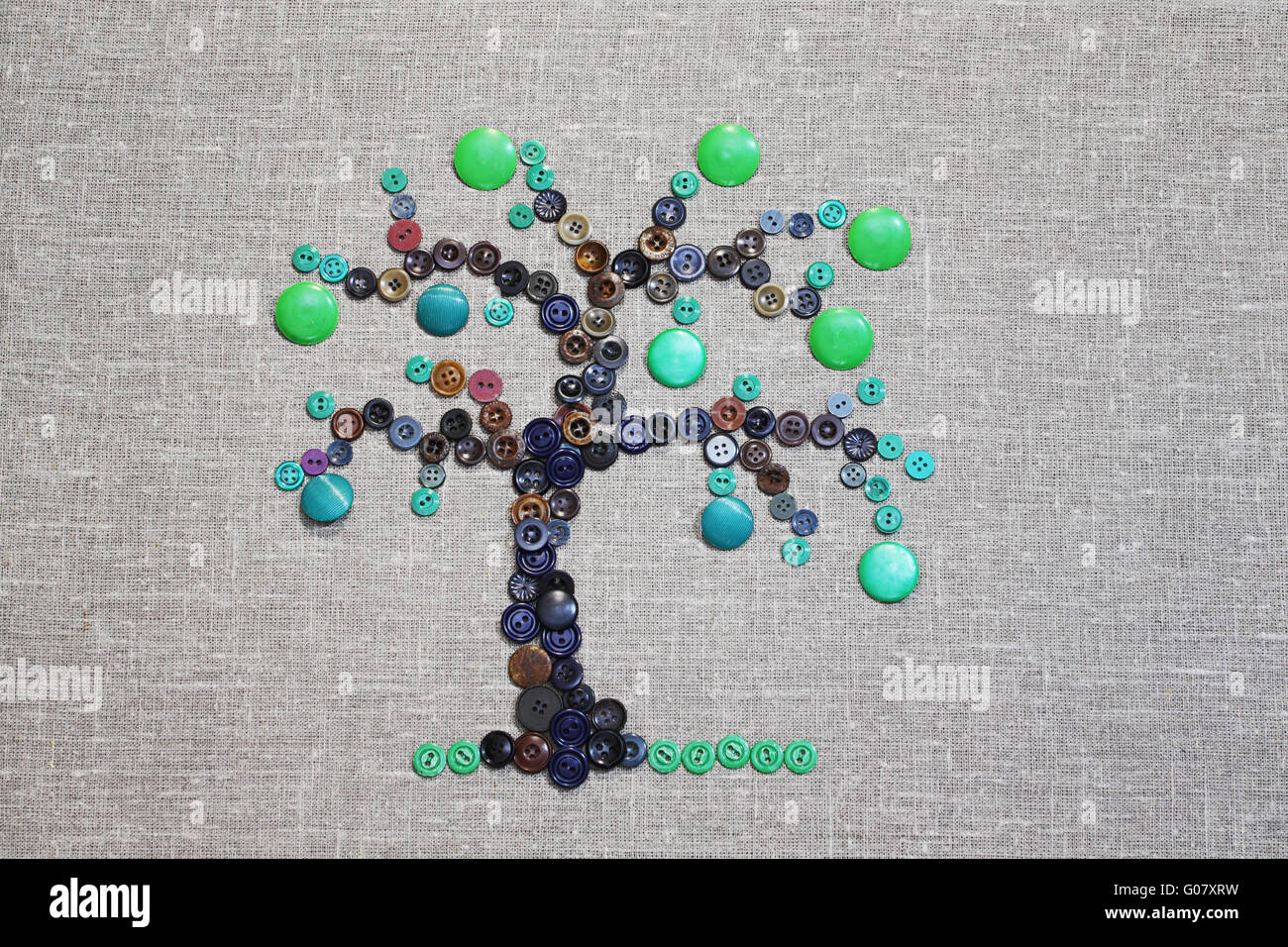 Tree with green fruit composed of the buttons Stock Photo - Alamy