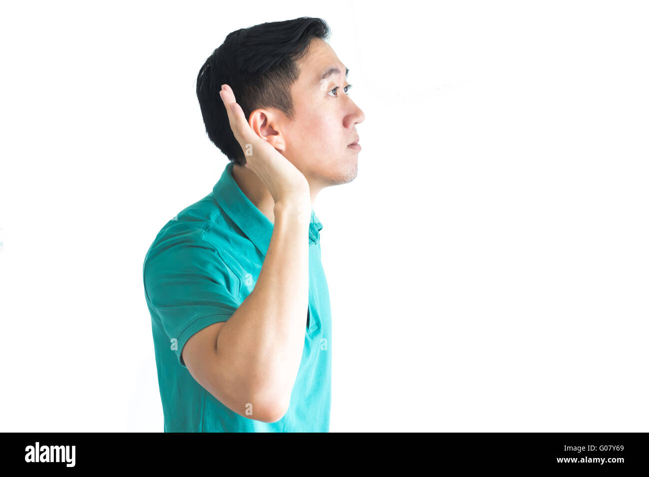Young asian man trying to listen to something Stock Photo - Alamy