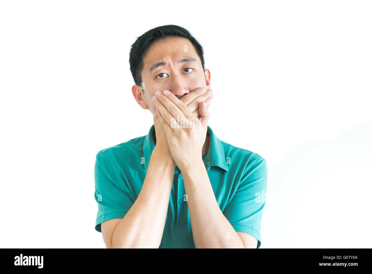 Young Asian man covering his mouth with hands Stock Photo - Alamy