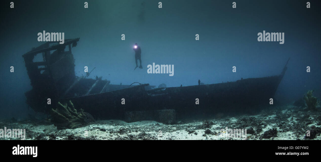 diver and a shipwreck Stock Photo - Alamy