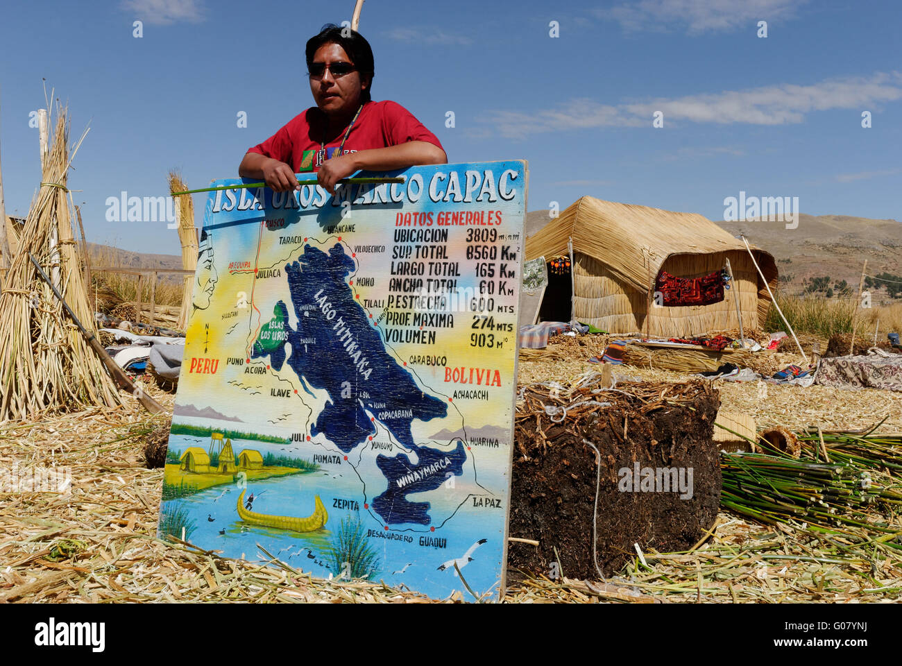 Tourist guide showing a map of the floating Uros Islands, Lake Titicaca ...