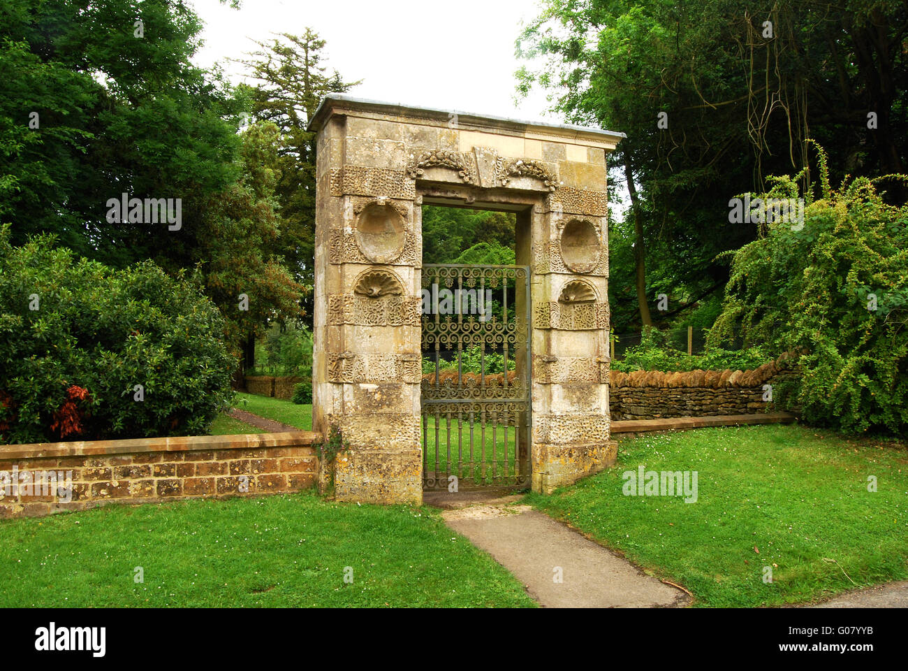Country old garden stone gate, sand path, iron doo Stock Photo - Alamy