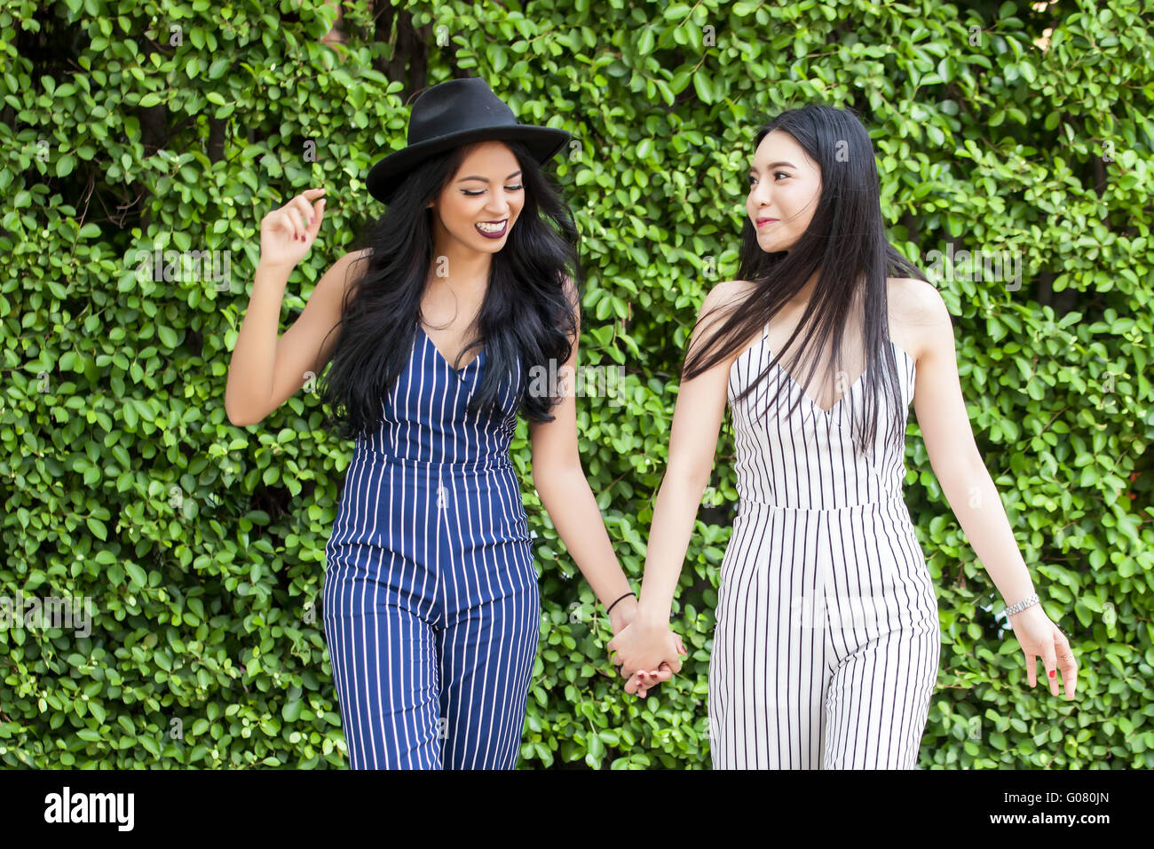Best friends taking a walk together in outdoor park. friendship and fun ...