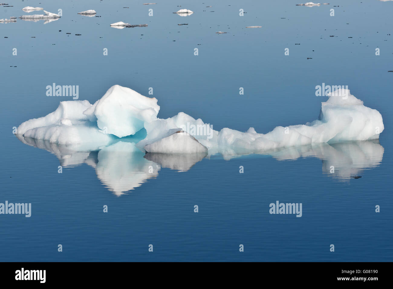 Landscape shot of some icebergs and their reflections in the water off ...