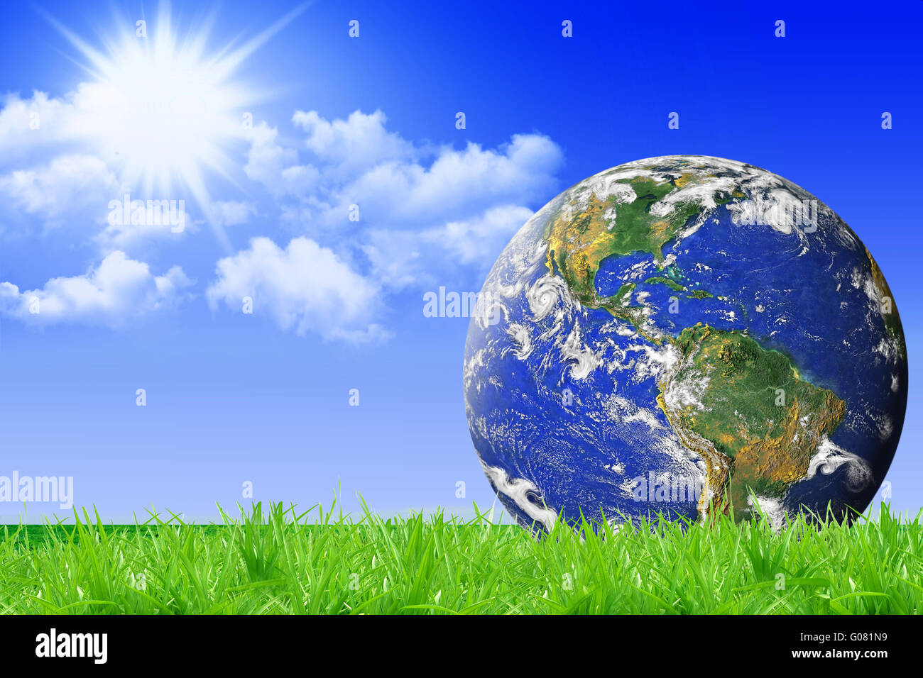 blue planet Earth on green grass and blue sky back Stock Photo - Alamy