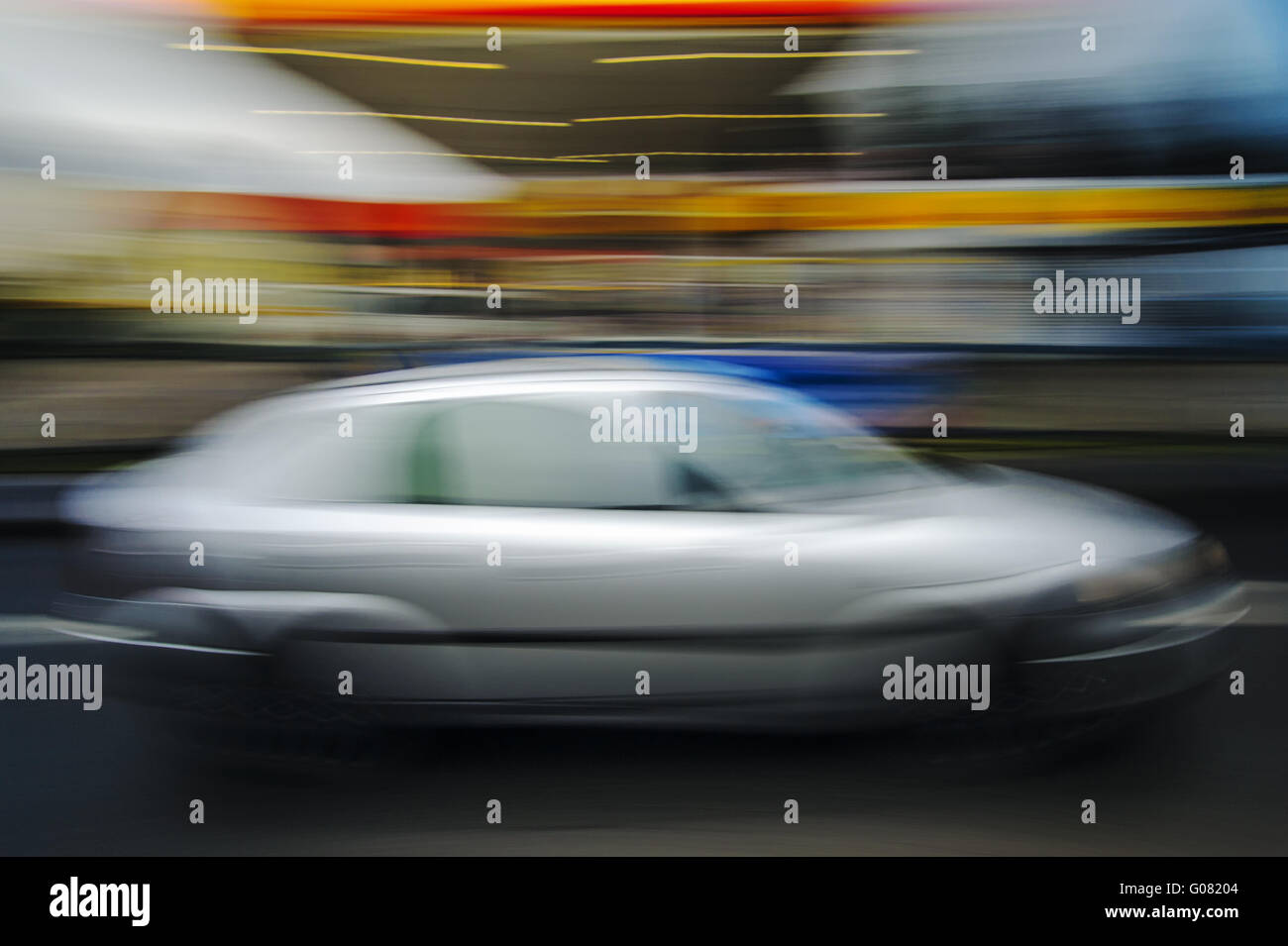 Car happens at breakneck speed a gas station Stock Photo - Alamy