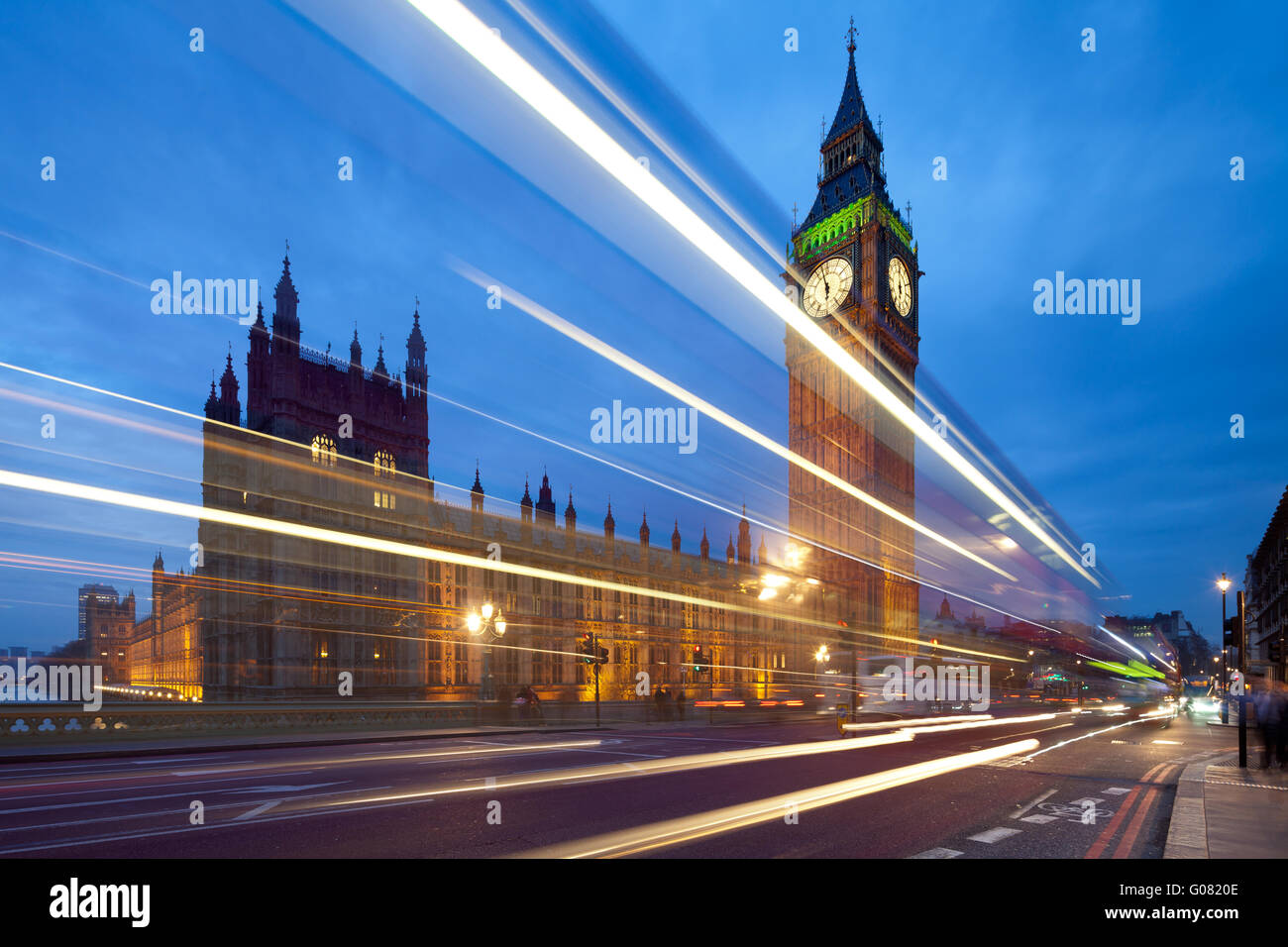 Big Ben behind light beams at twilight time, London, UK Stock Photo - Alamy