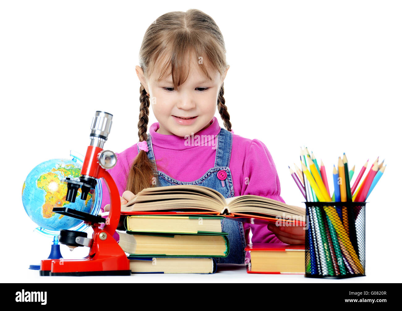 The little girl learn isolated on white background Stock Photo - Alamy