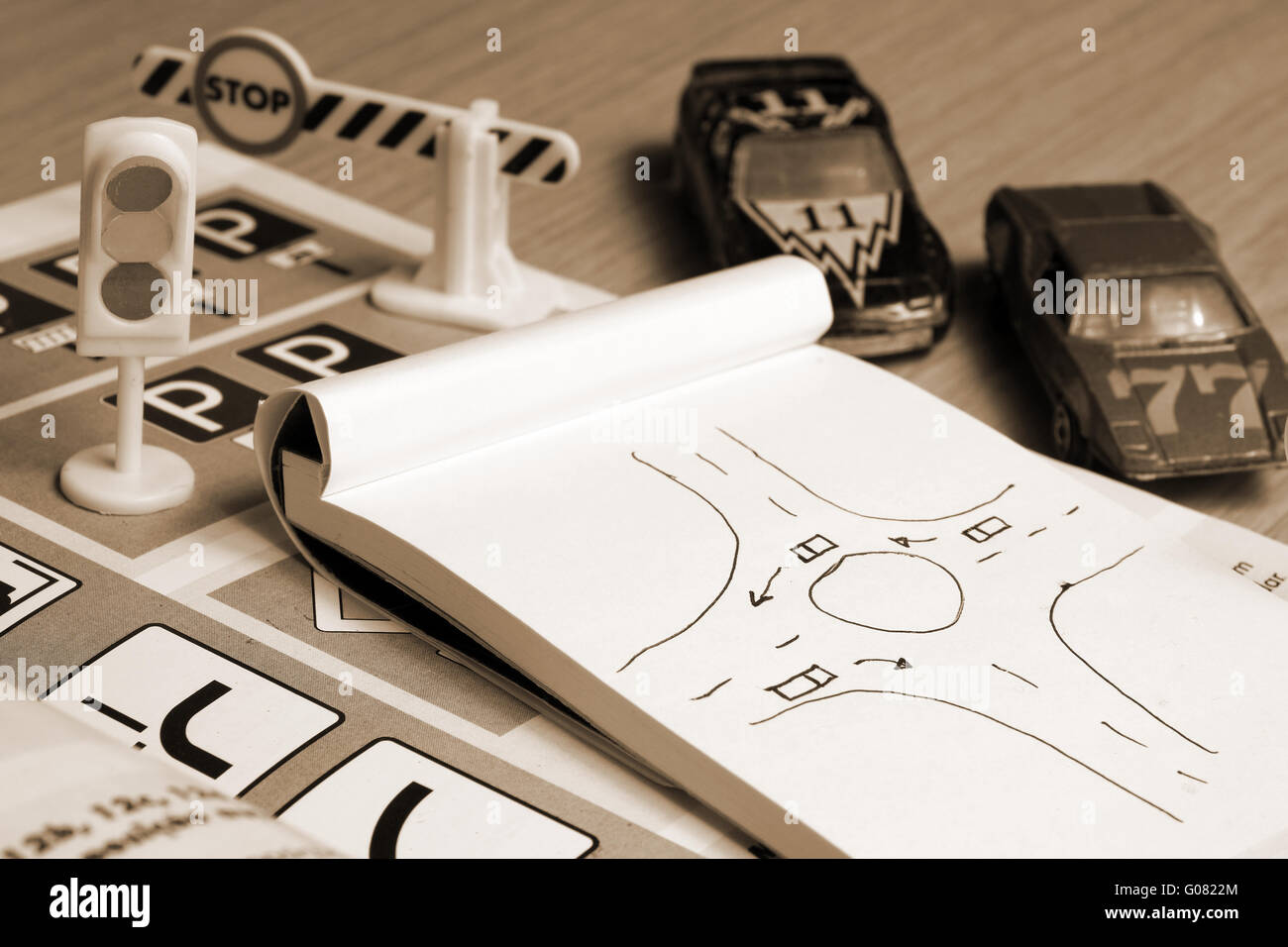 Notepad, book of traffic rules and pen on a desk table. Studying and ...