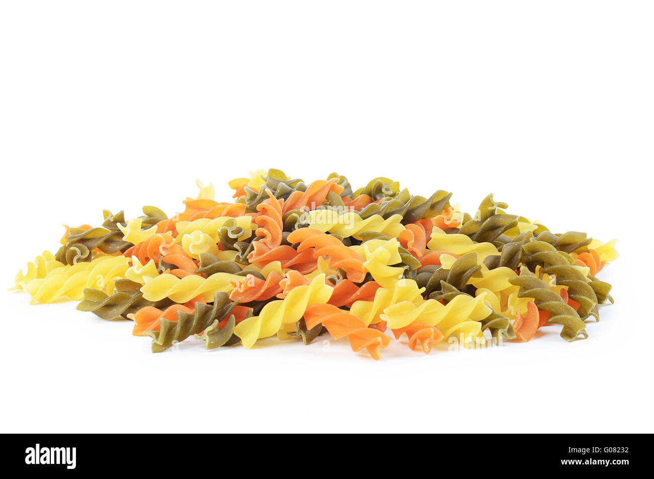 Raw colored pasta fusilli isolated on white background Stock Photo - Alamy