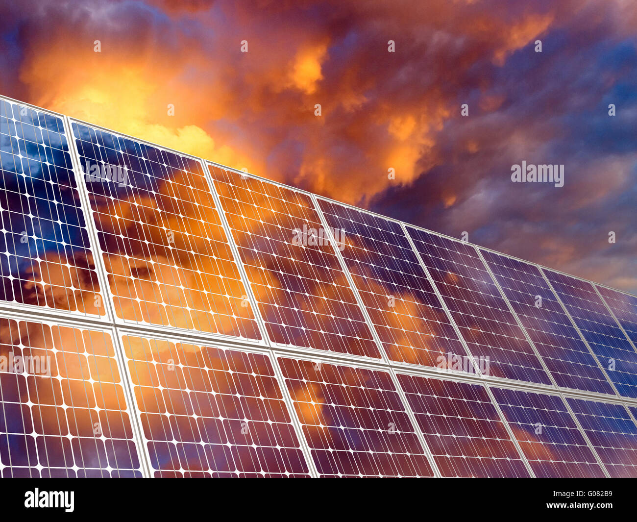 Solar battery on sunset sky background Stock Photo - Alamy