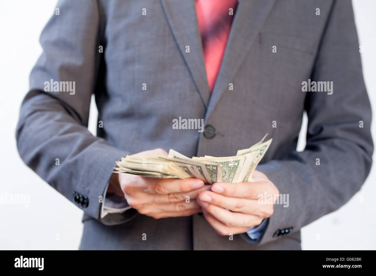 Businessman counting bill notes in white isolated background Stock ...