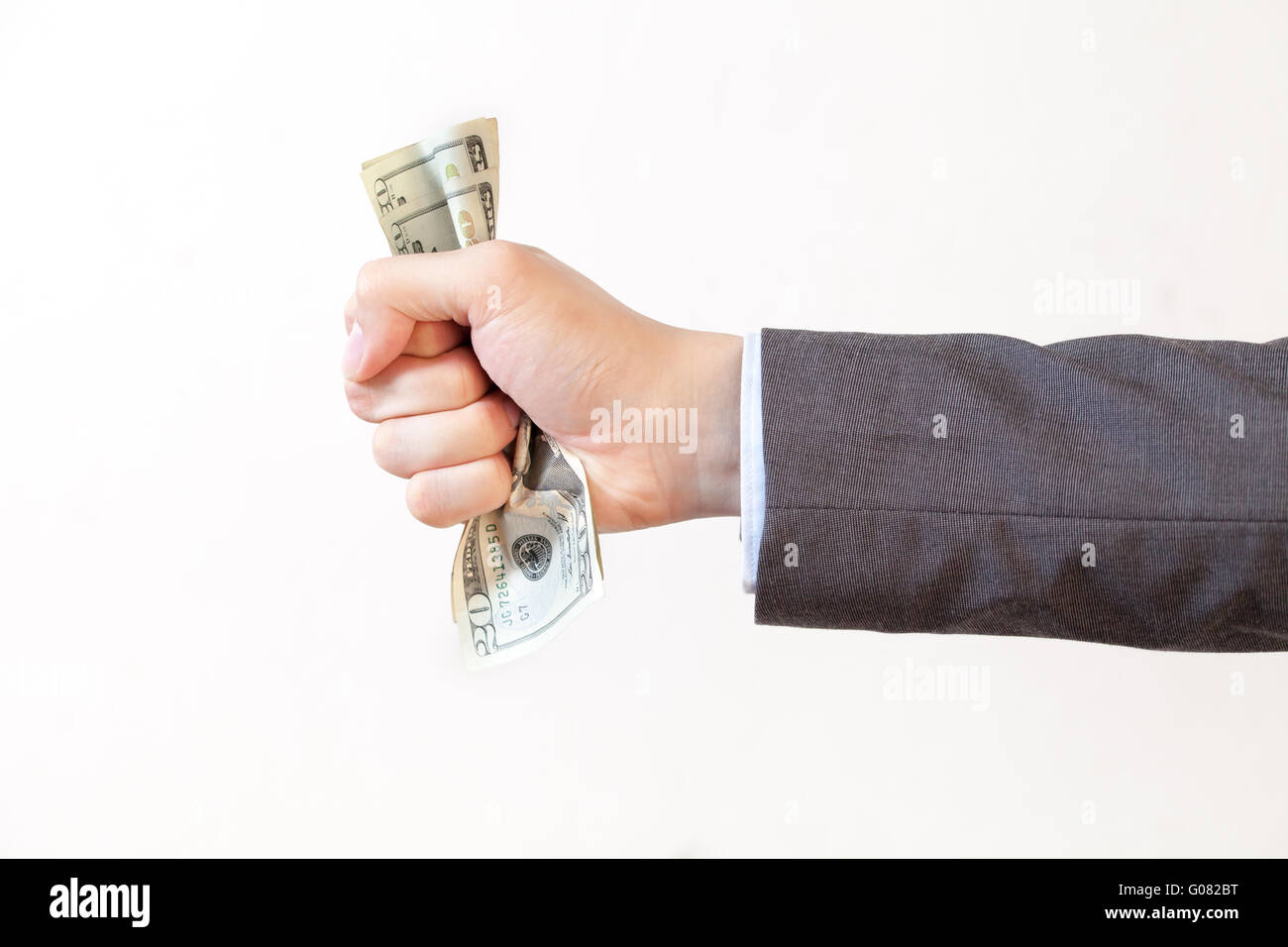 Hand squeezing money hi-res stock photography and images - Alamy