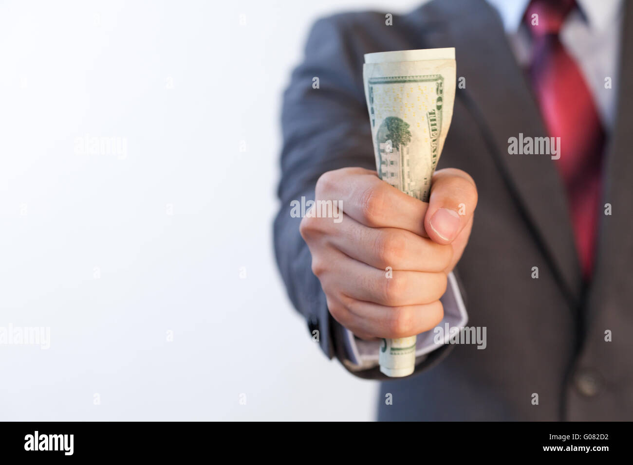 Hand squeezing money hi-res stock photography and images - Alamy