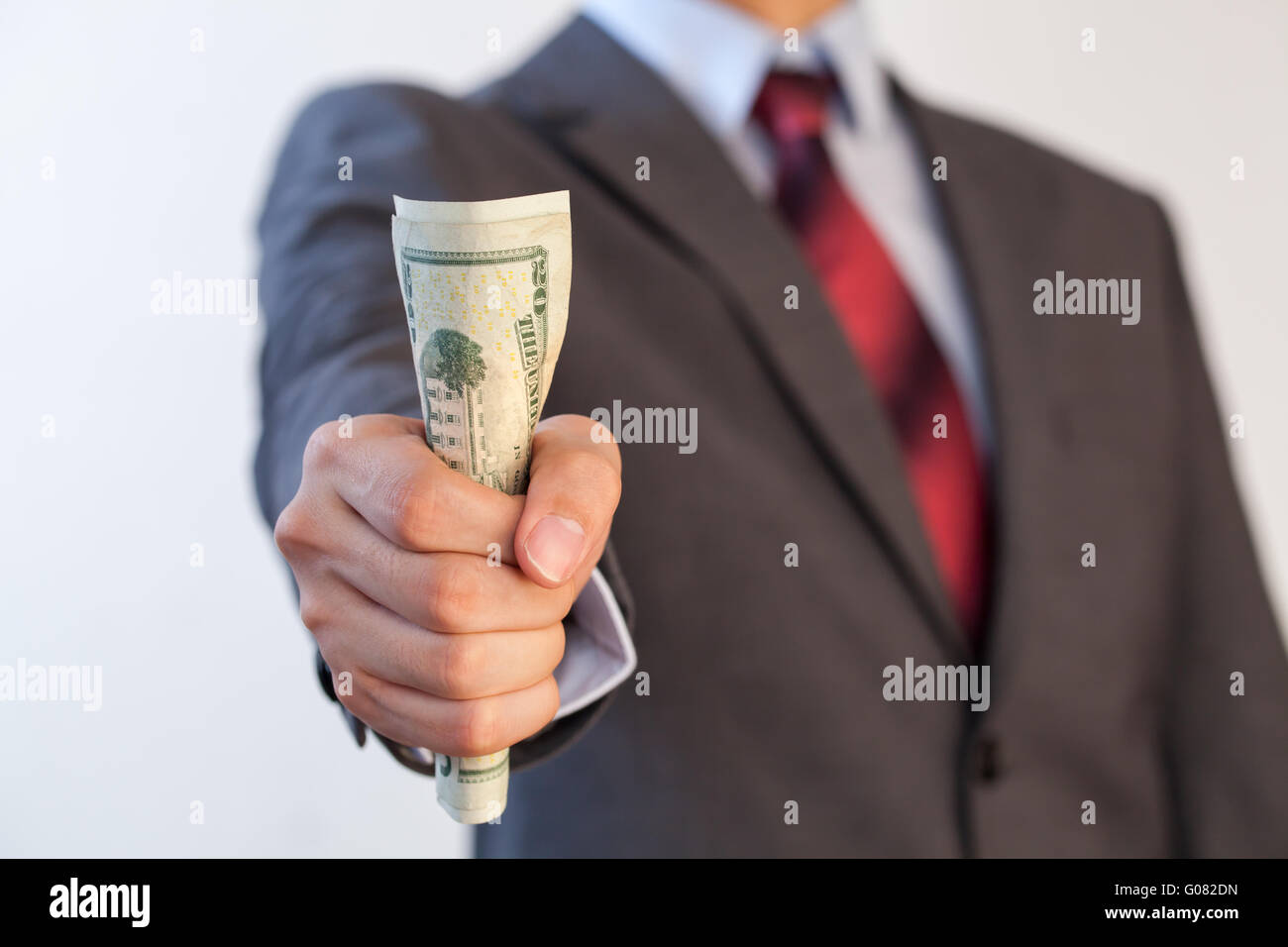 Hand squeezing money hi-res stock photography and images - Alamy