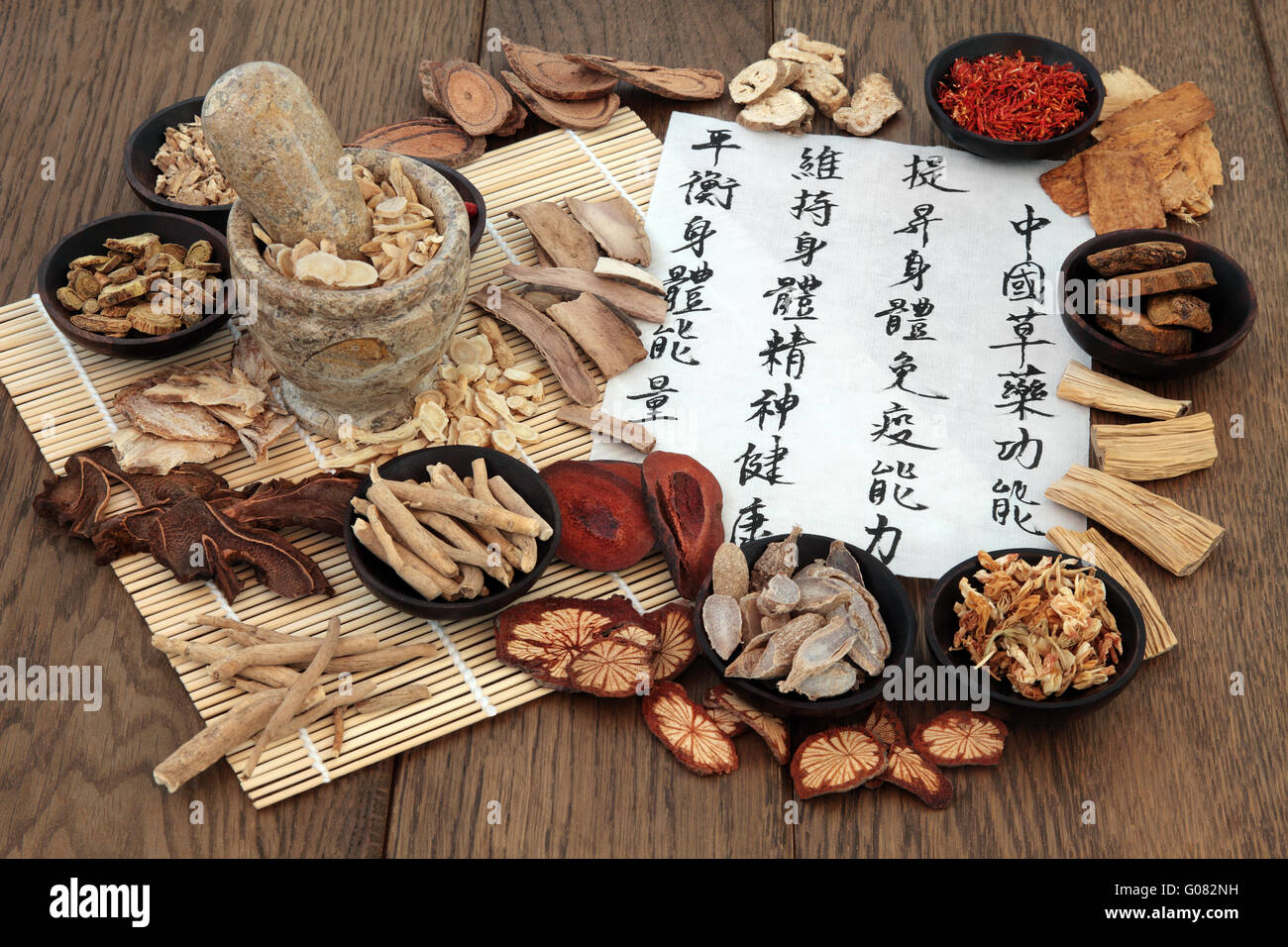 Chinese herbal medicine with herb ingredients and calligraphy on rice ...