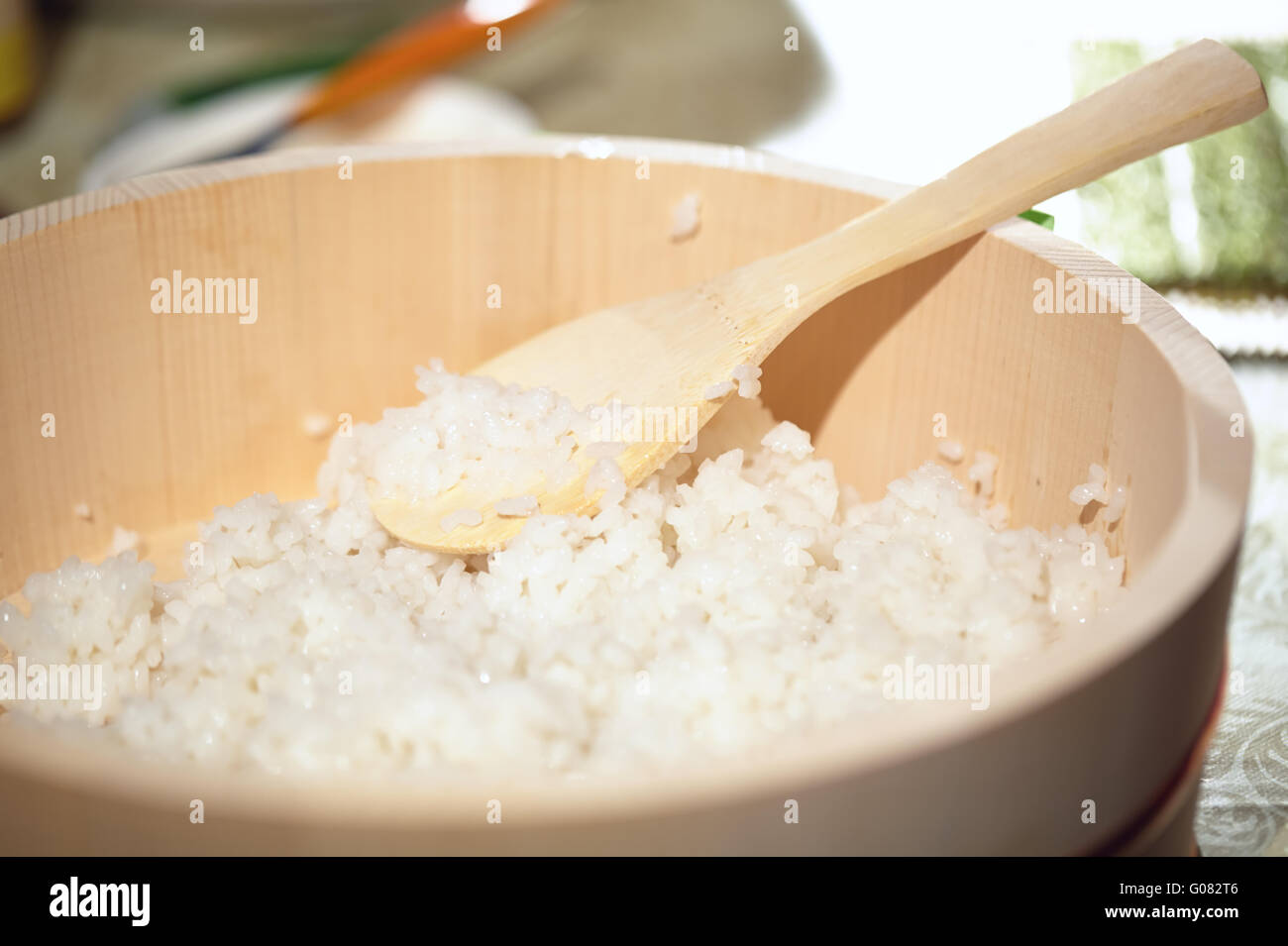 Cooking sushi. Mixing rice in a wooden plate Stock Photo - Alamy