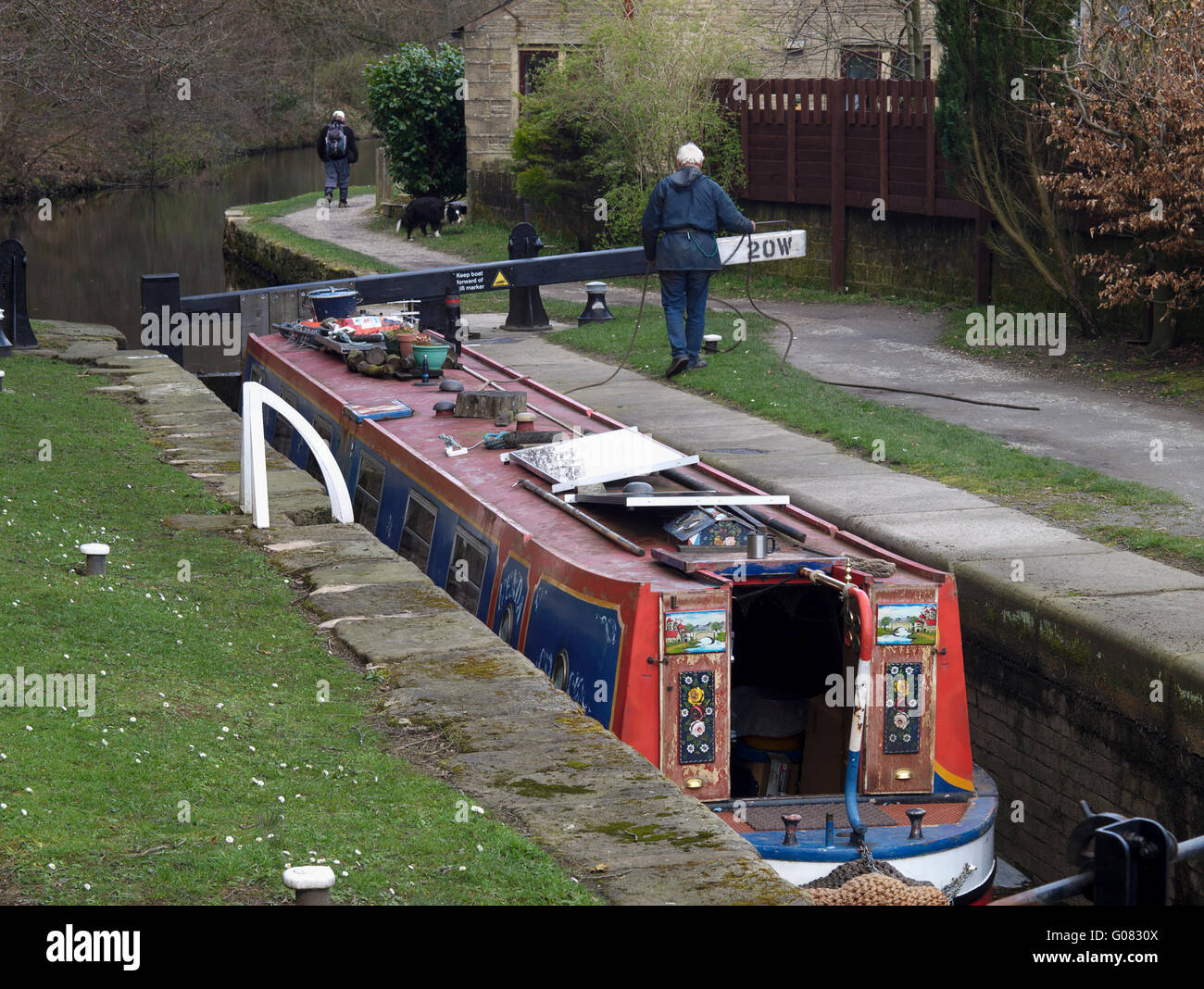 Barge passing through Halls Lock in Greenfield on the Huddersfield ...