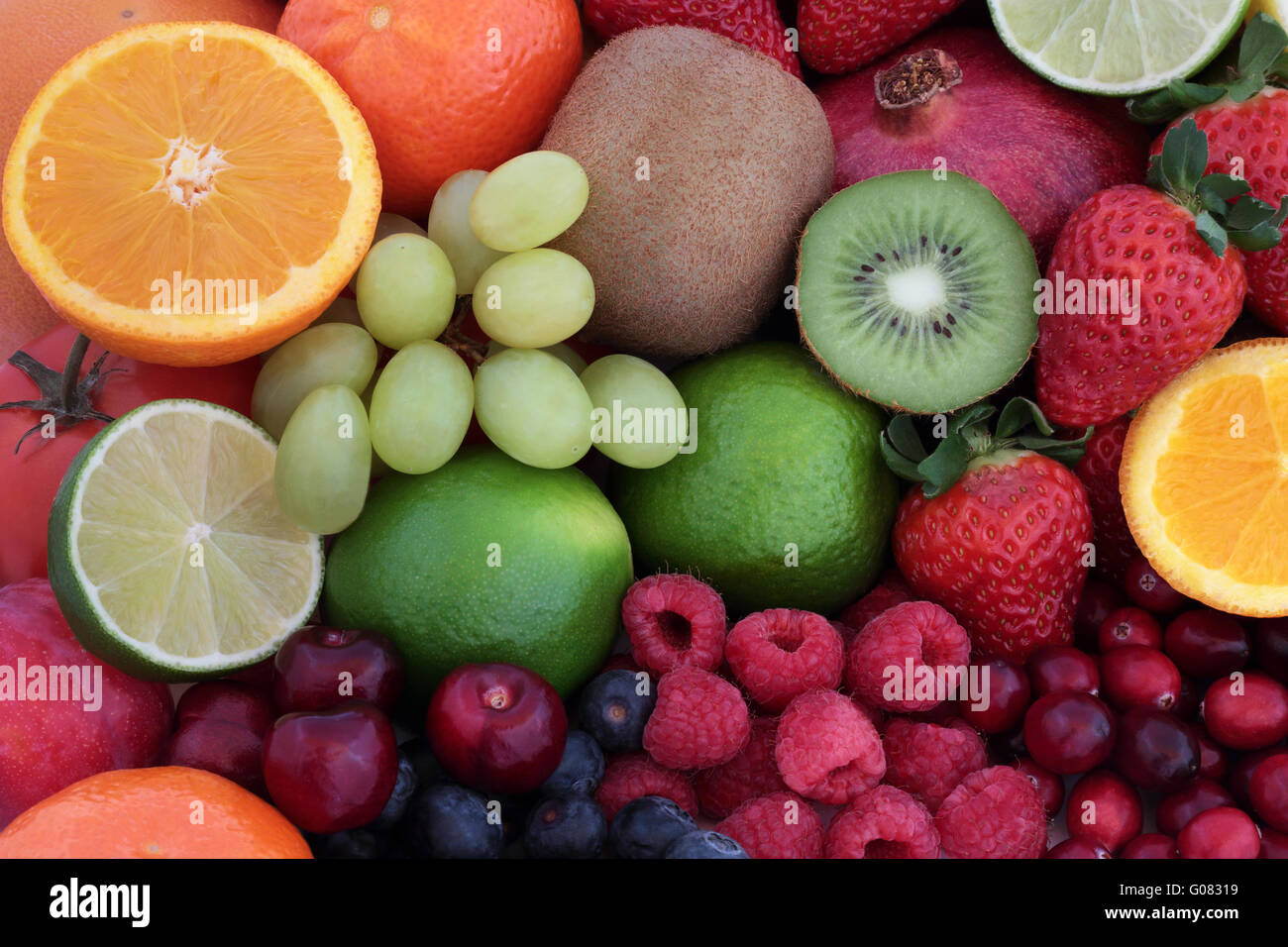 Healthy fresh fruit super food background with fruits. High in ...