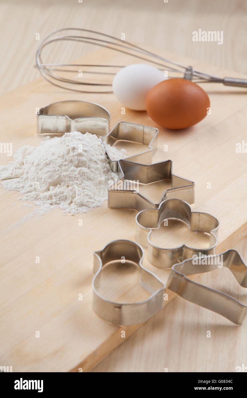 collection of Cookie cutter forms around flour on Stock Photo - Alamy