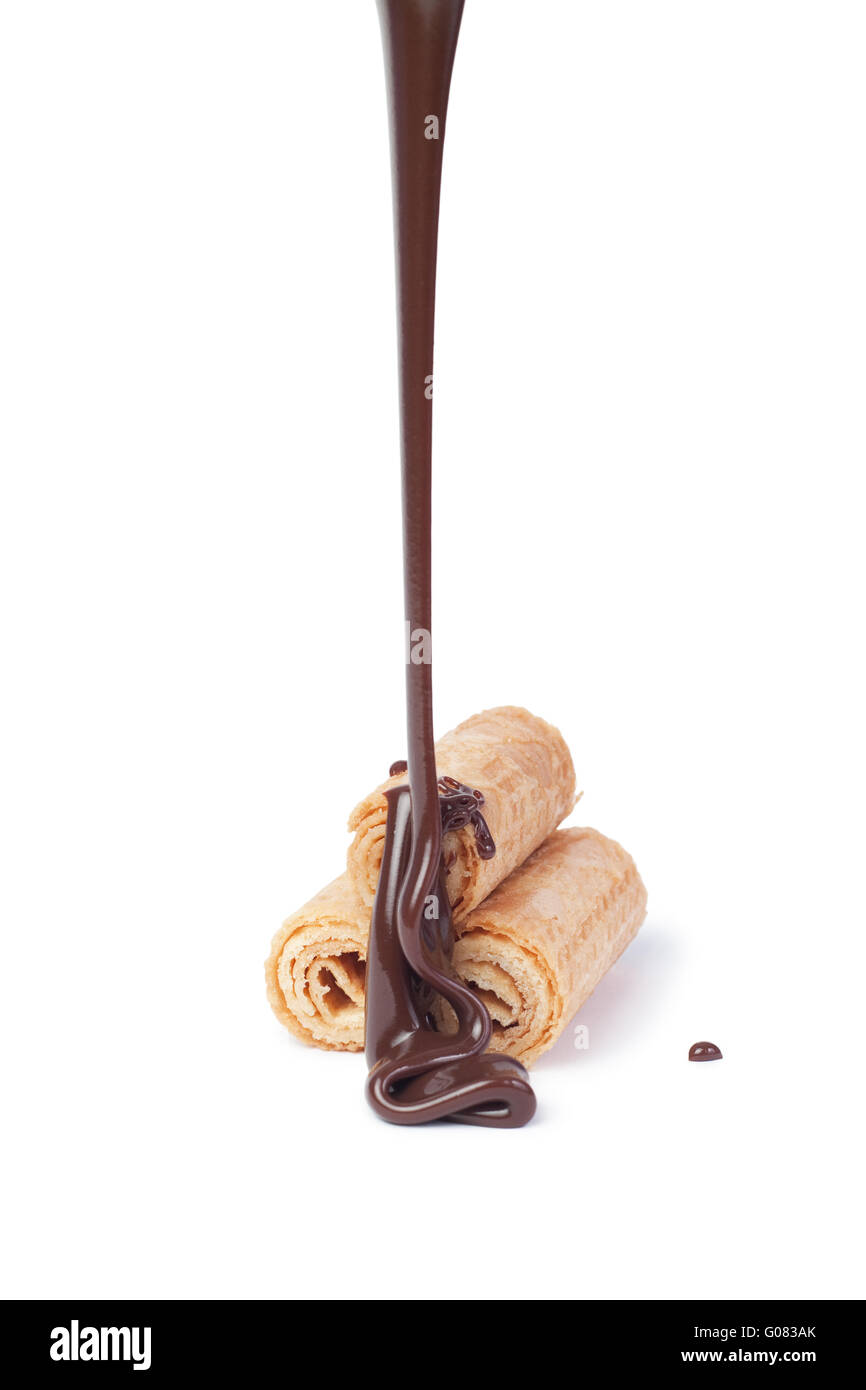 chocolate pouring onto waffle roll isolated on whi Stock Photo - Alamy