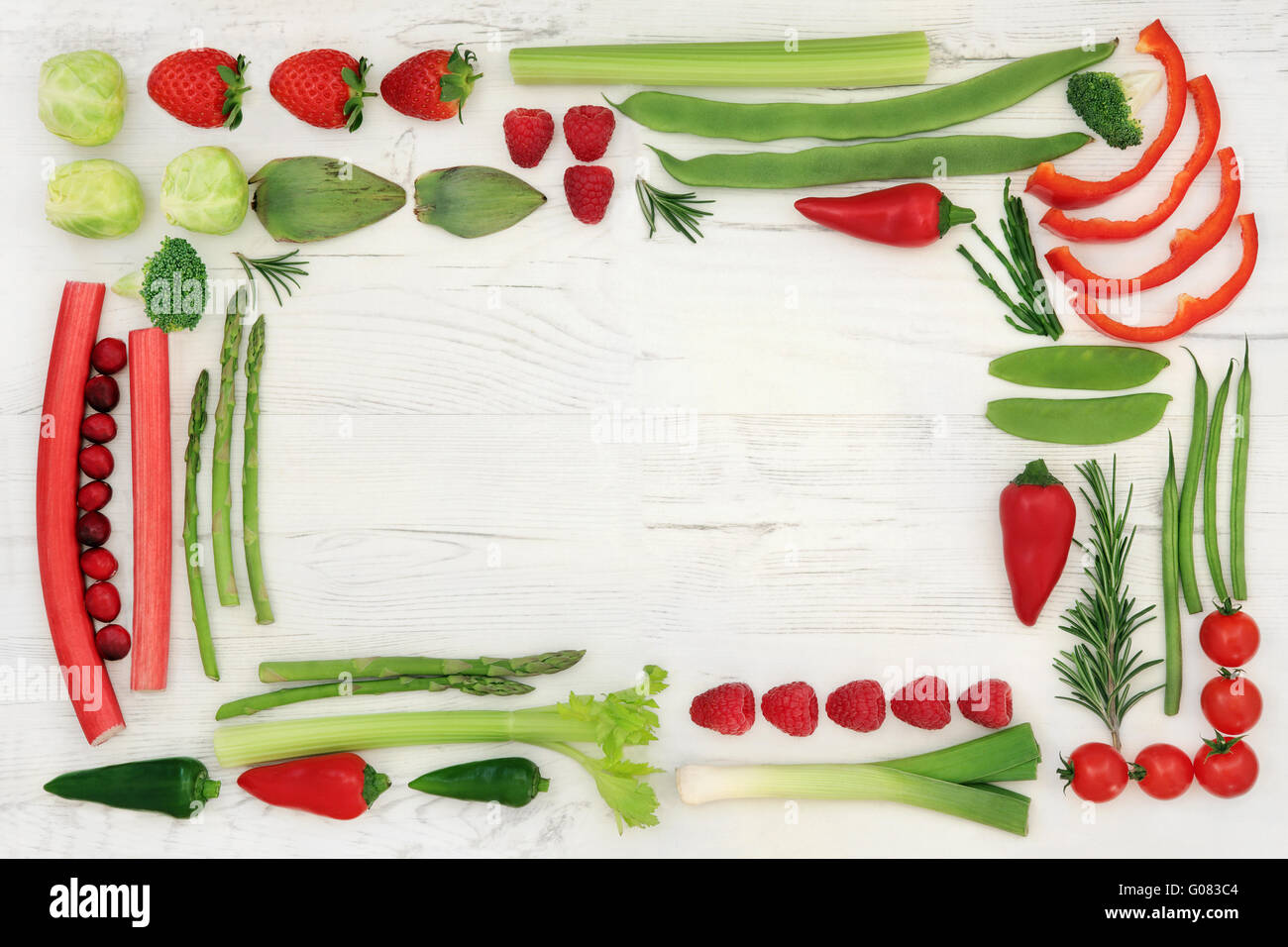 Red and green fresh health food border with vegetable and fruit ...