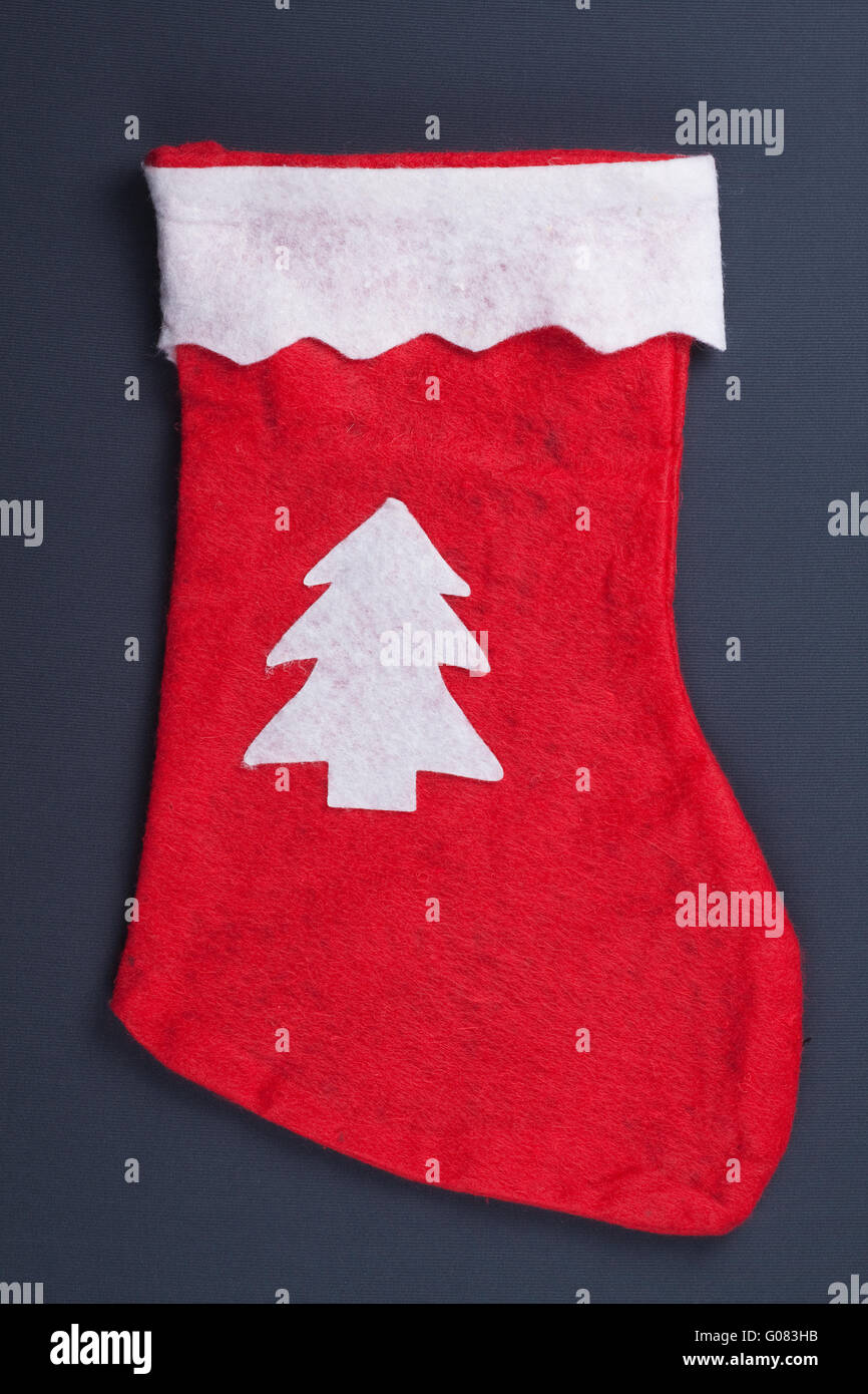 red stocking over grey background christmas concep Stock Photo - Alamy